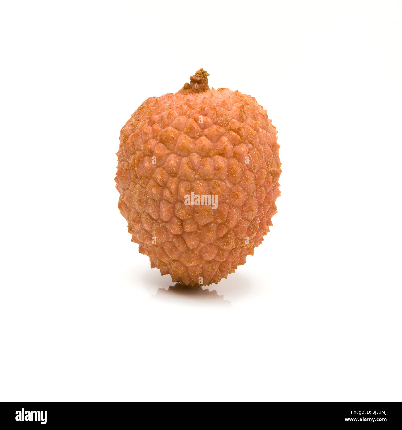 Single Lychee also known as Chinese Gooseberry isolated against white ...