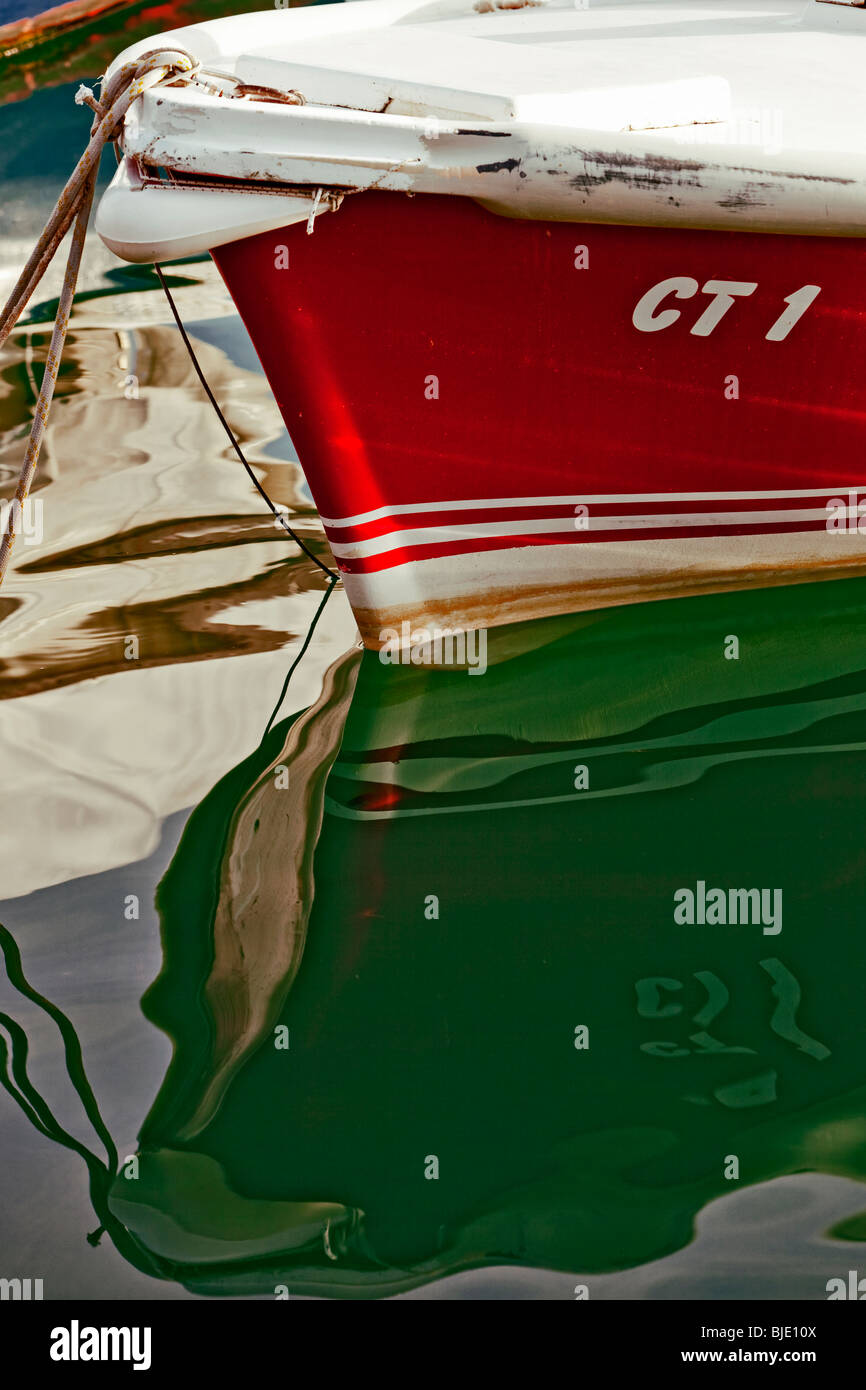 Maritime reflections of boats in a harbour Stock Photo - Alamy