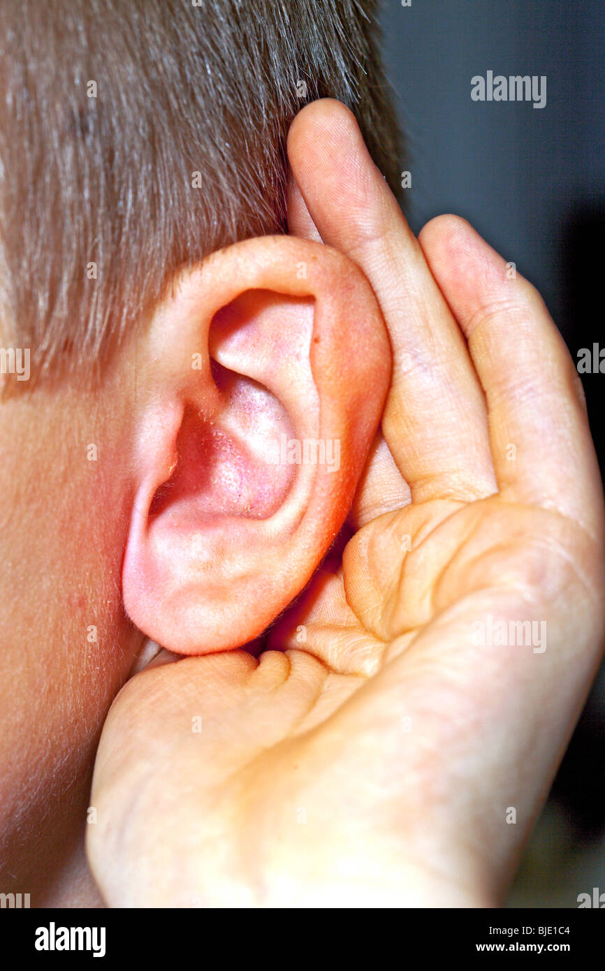Hand cupped to ear hi-res stock photography and images - Alamy