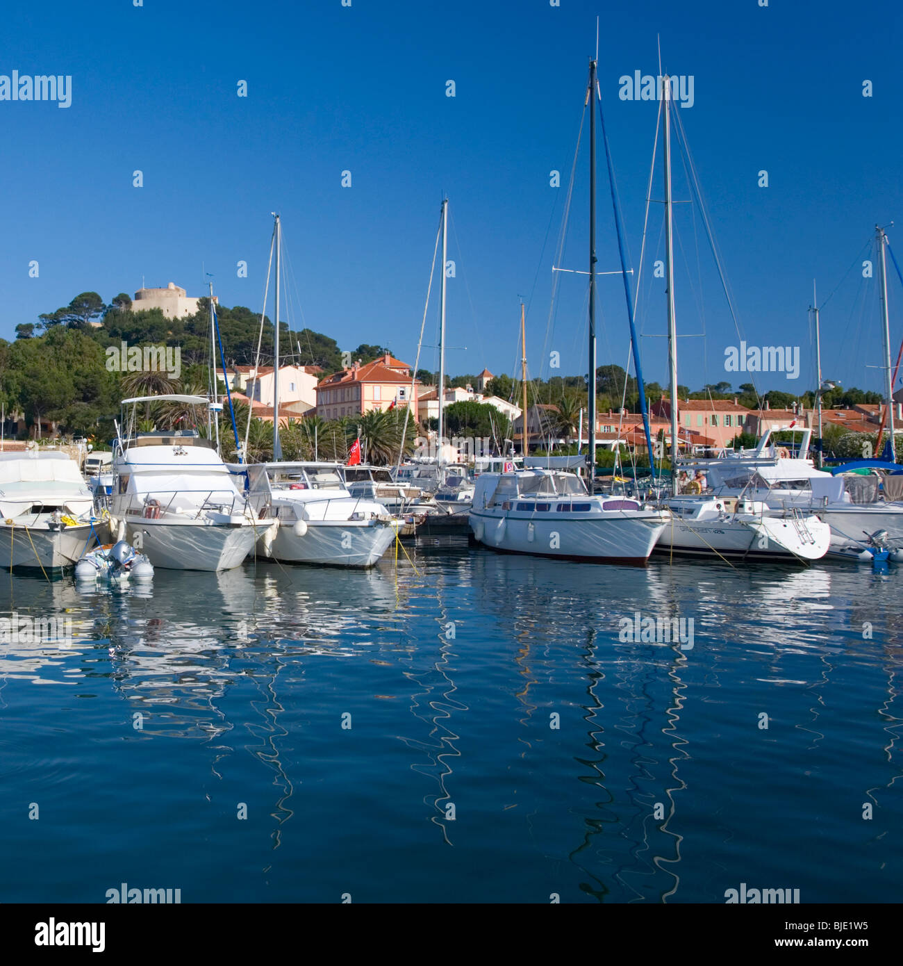 Porquerolles, Provence, France. View across harbour to the village and ...