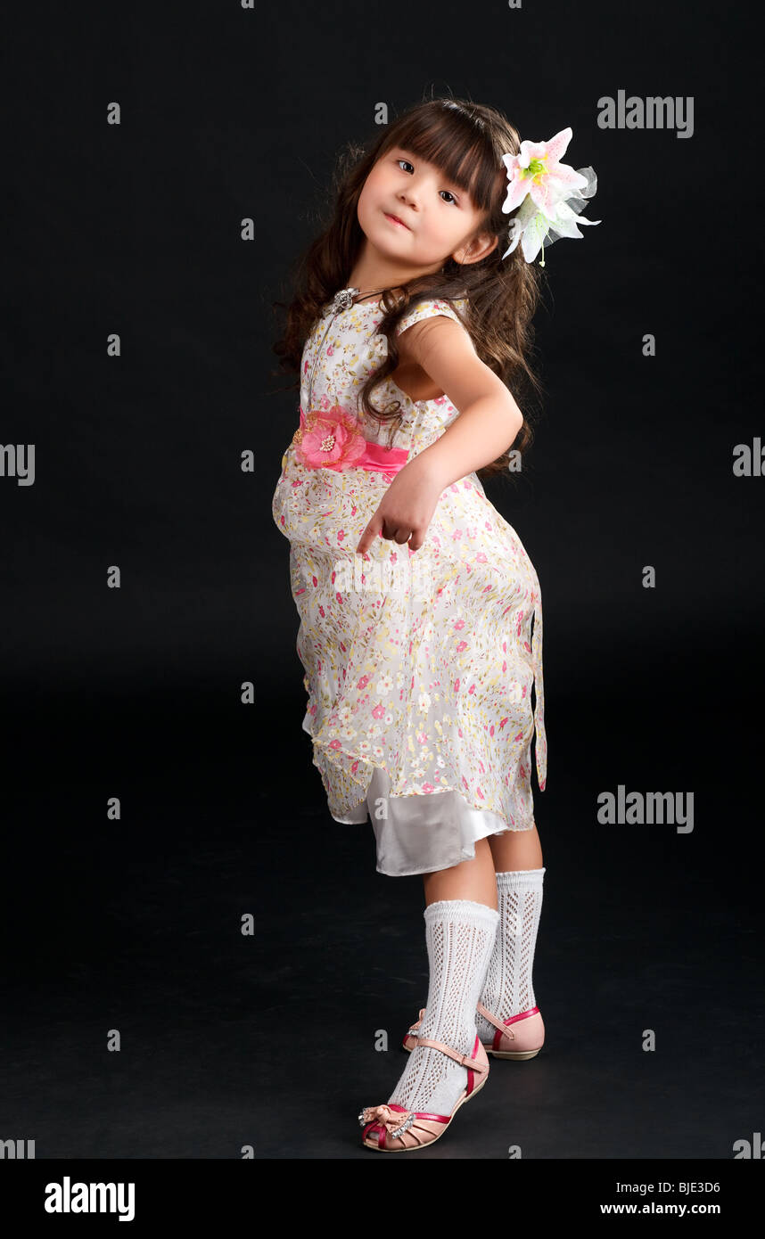 Little fashion model posin in studio Stock Photo - Alamy