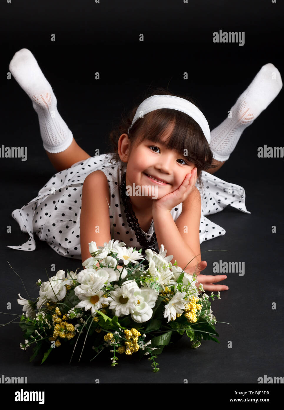 Little fashion model posin in studio Stock Photo - Alamy