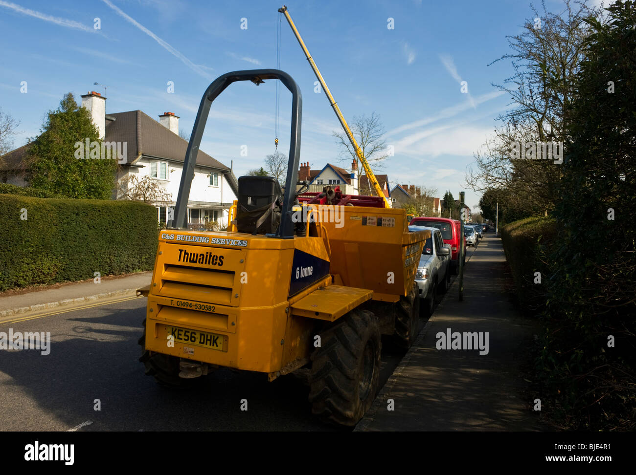 Construction vehicle and building equipment parked in a side road in ...