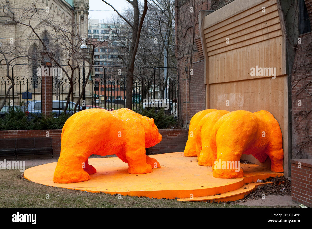 Acid-orange bears move in communion, towards and through a wall, and ...