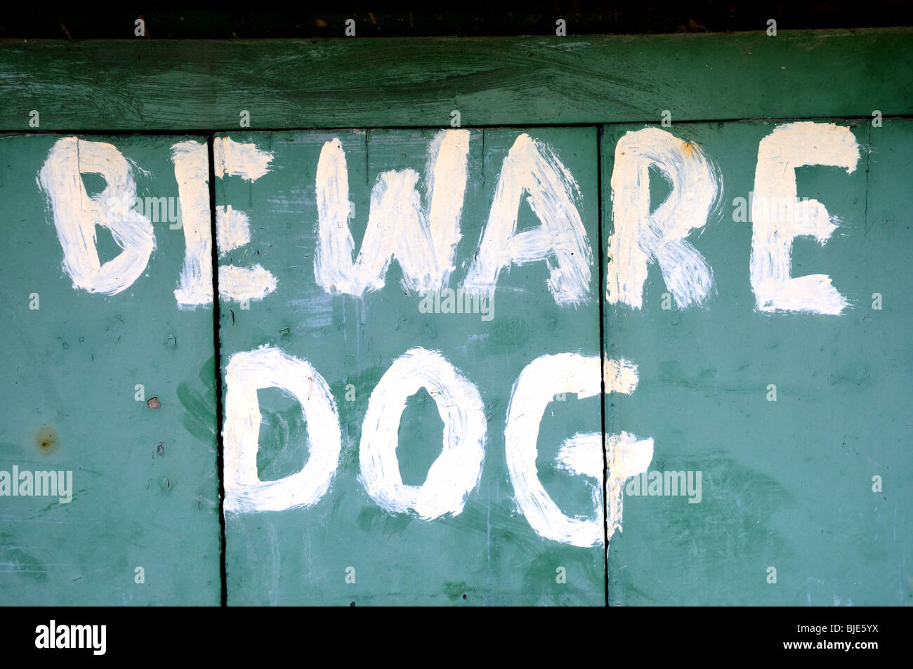 Beware of the Dog Sign Painted on Wooden Gate Stock Photo - Alamy