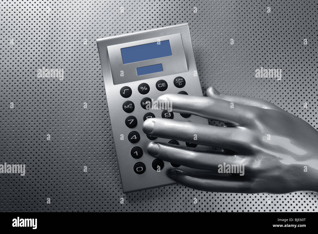 business futuristic silver hand metaphor on calculator keyboard Stock ...
