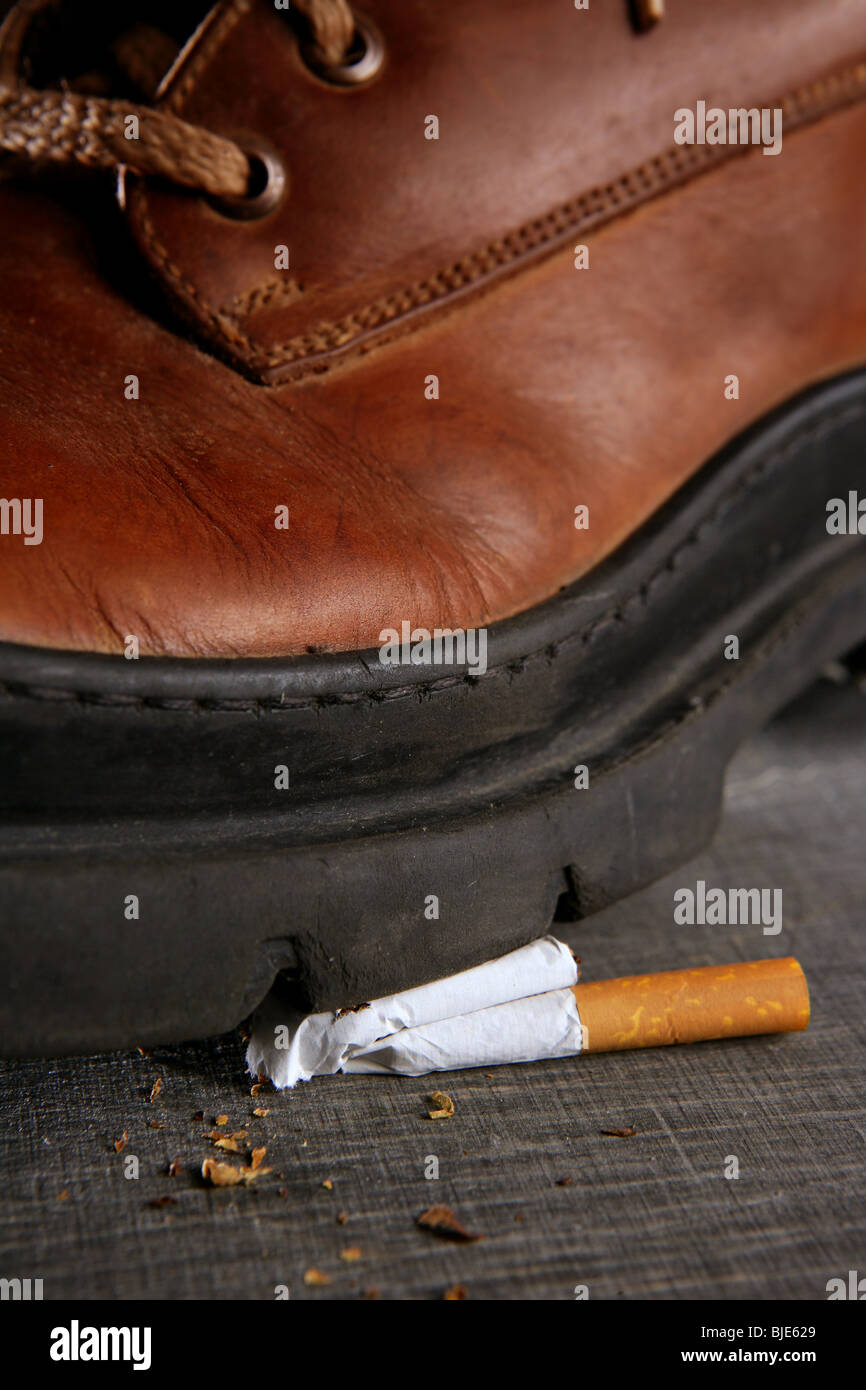 Boot treading cigarette tobacco addiction concept metaphor Stock Photo ...