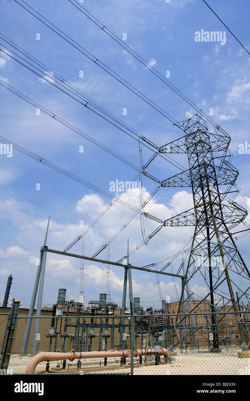 Electric tower and cables over blue sky Stock Photo - Alamy