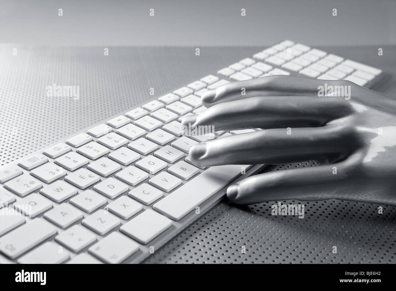 computer keyboard aluminum gray hand silver background Stock Photo - Alamy