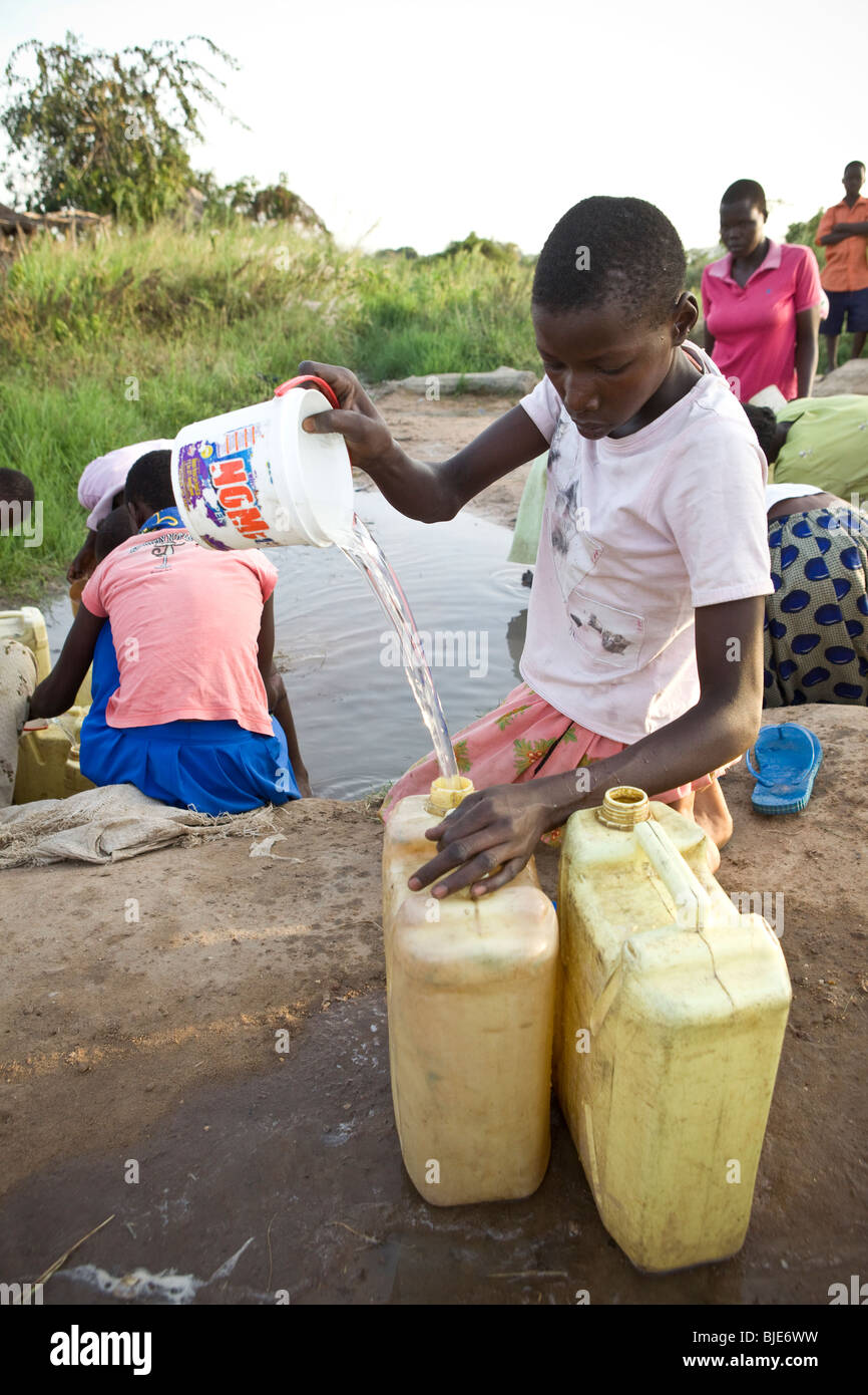 African Child Drinking Dirty Water High Resolution Stock Photography ...