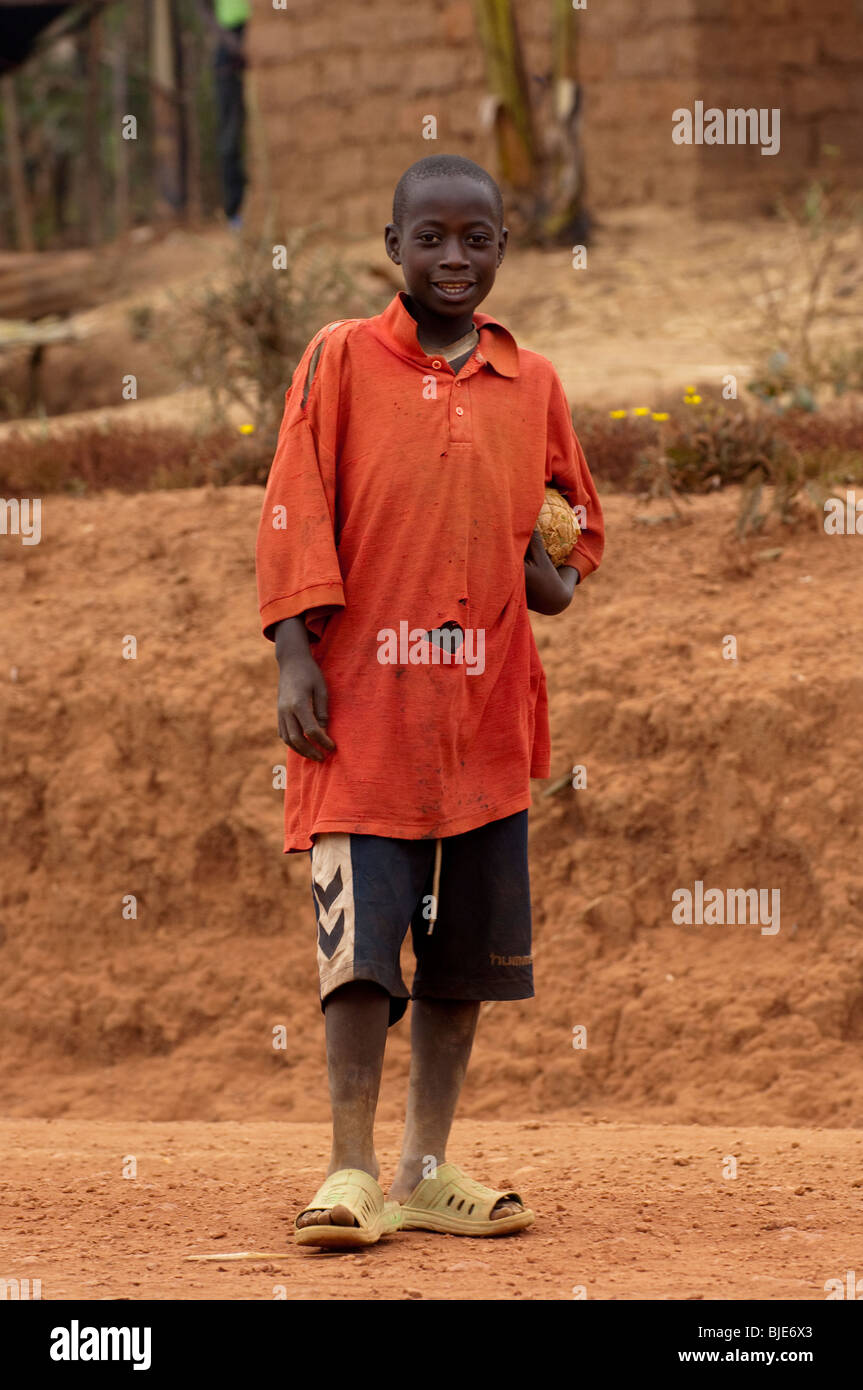 Young boy with a football on the street in Rwanda Stock Photo - Alamy