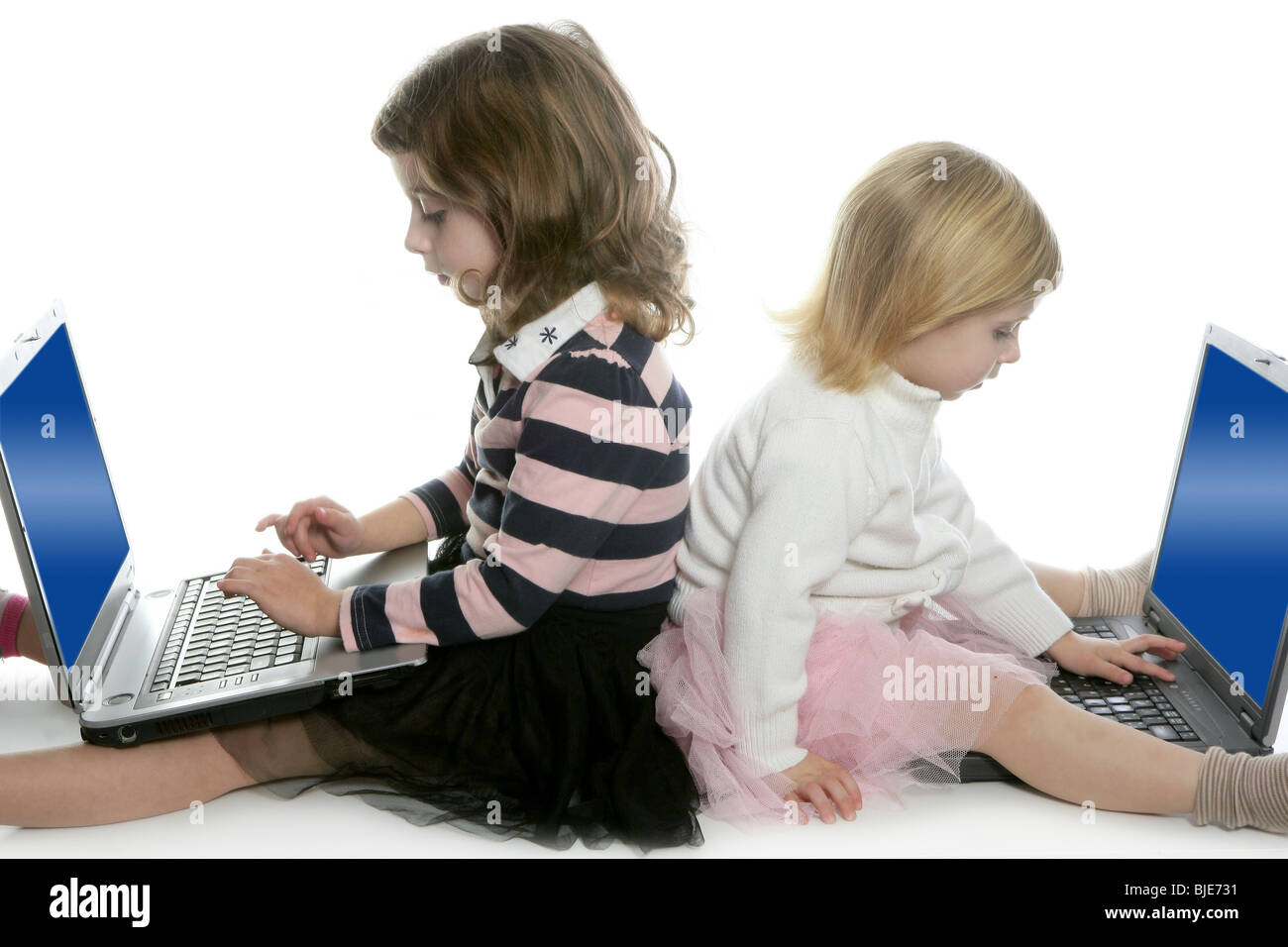 two little girls sister studying computer laptops at school Stock Photo ...
