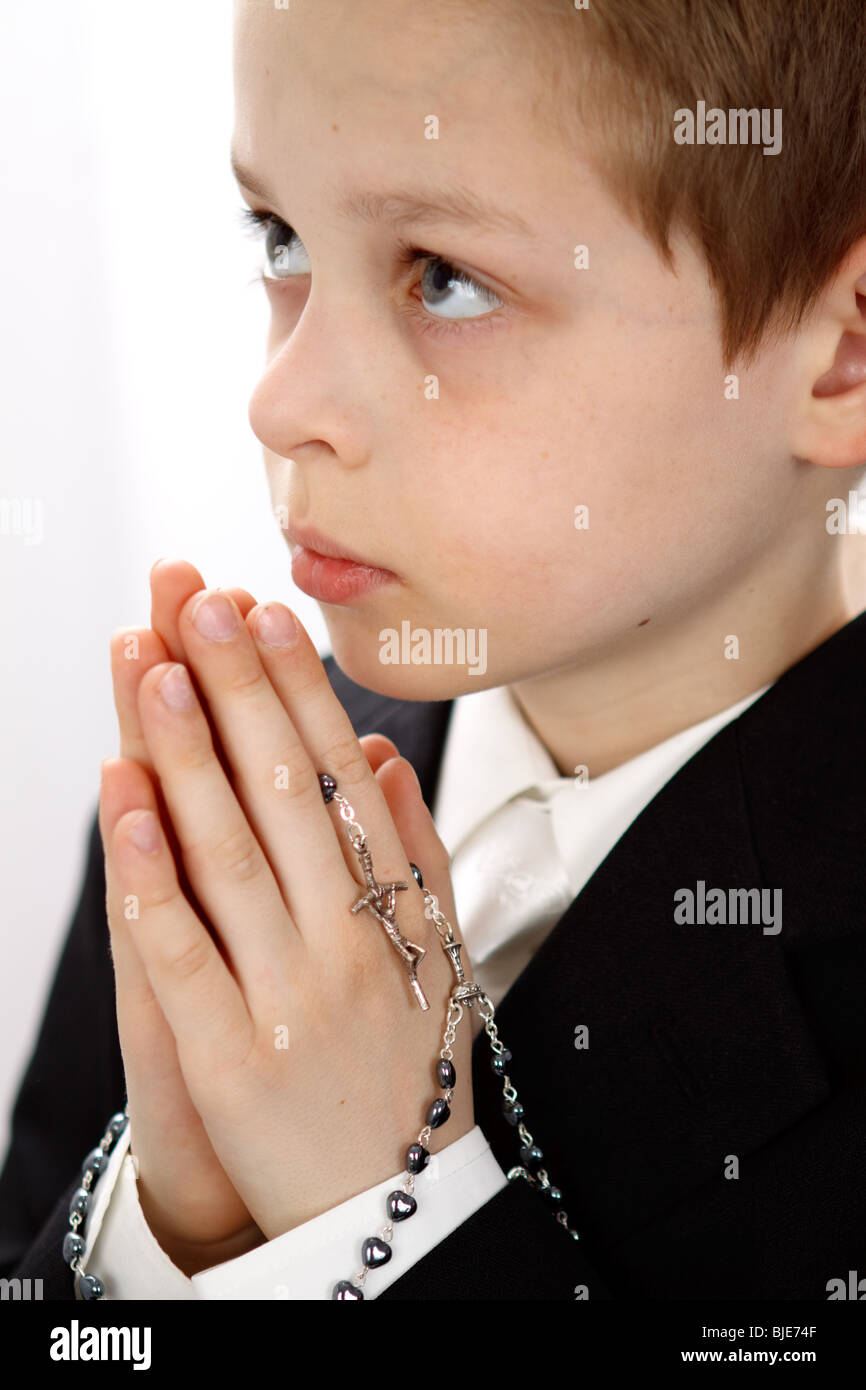 Boy pray rosary hi-res stock photography and images - Alamy