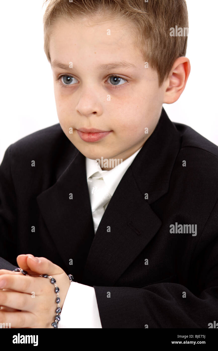 Boy pray rosary hi-res stock photography and images - Alamy