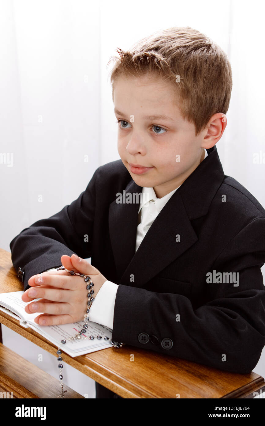 Boy pray rosary hi-res stock photography and images - Alamy
