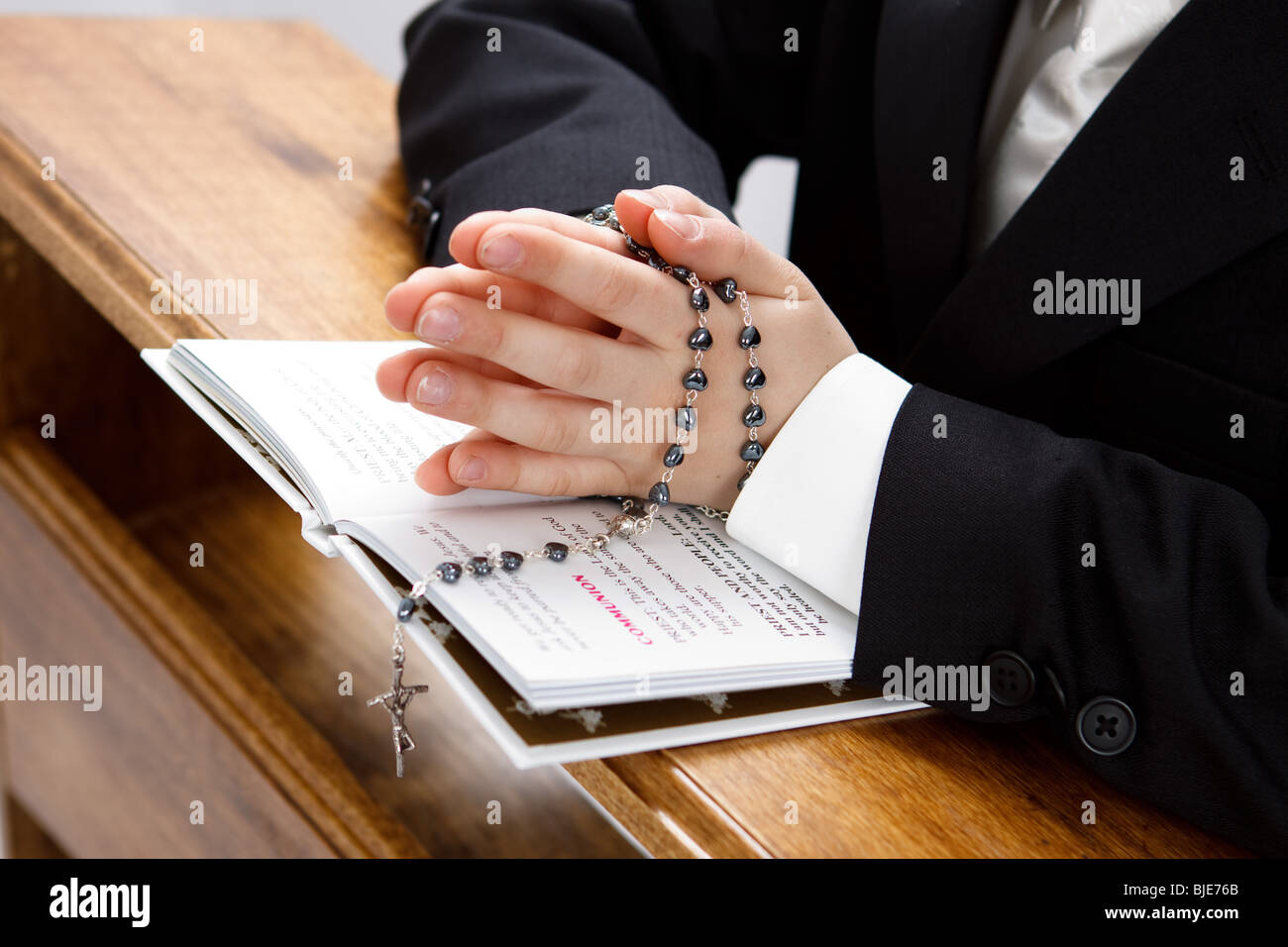 Child praying church hi-res stock photography and images - Alamy