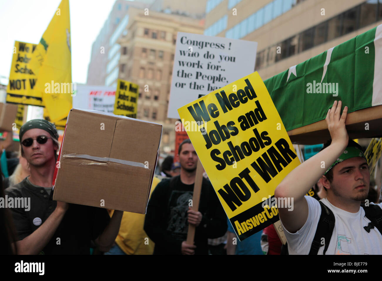Protesters carrying cardboard coffins marching against War. Anti-war ...