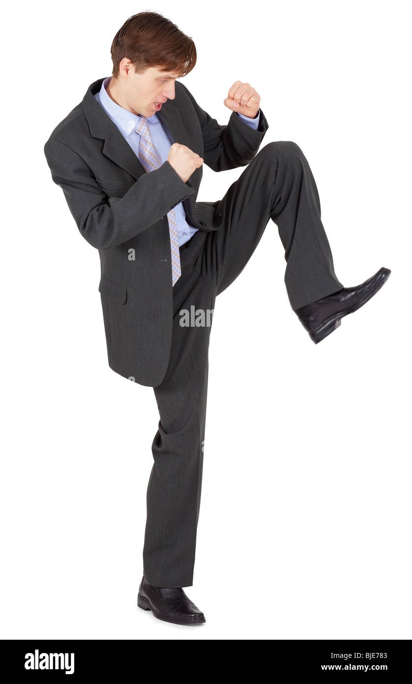 A young man kicks, isolated on a white background Stock Photo - Alamy