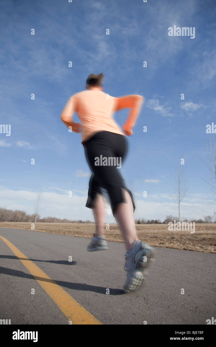 Woman running in slow motion hi-res stock photography and images - Alamy