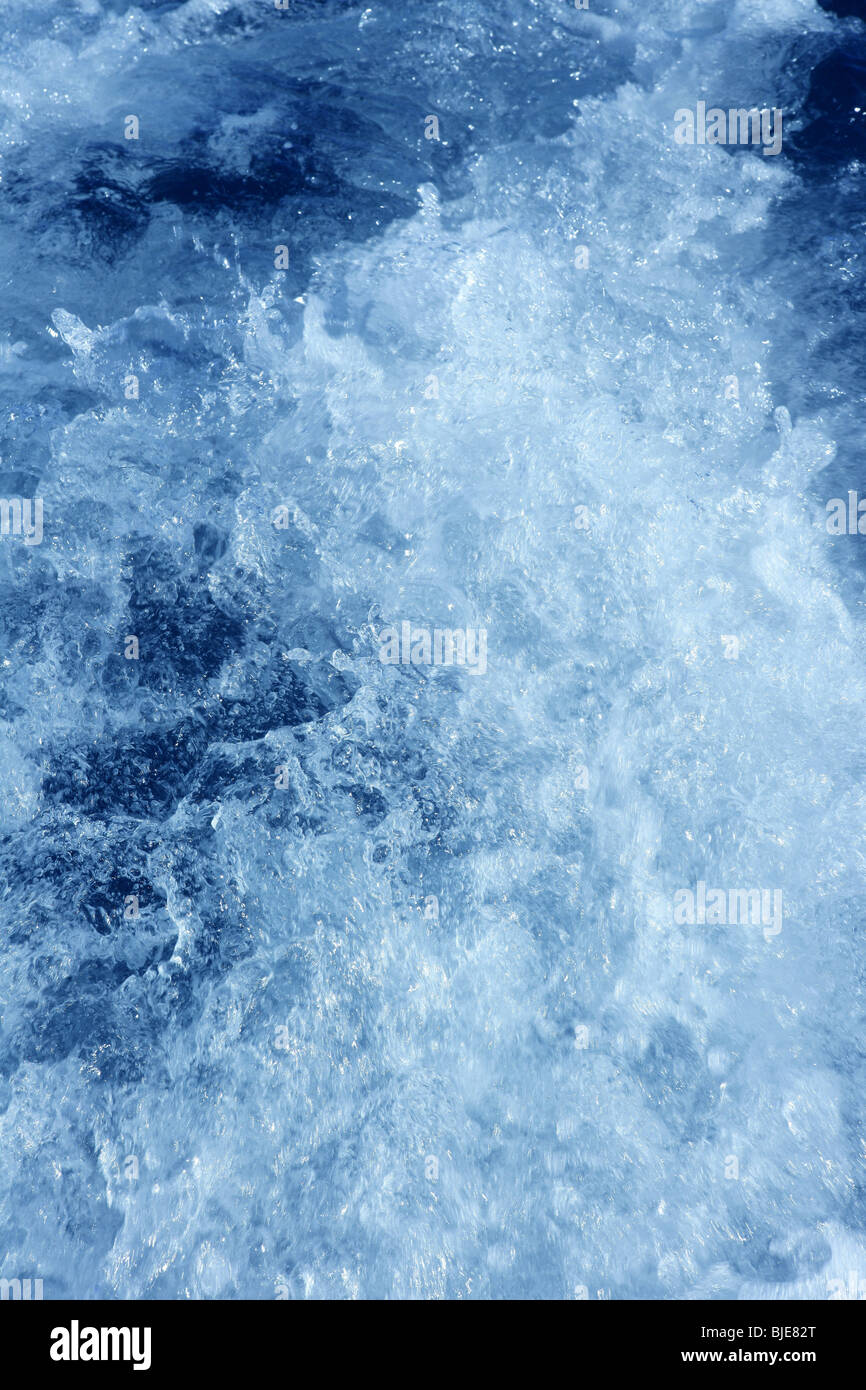 Boat wake foam water propeller wash blue saltwater Stock Photo - Alamy