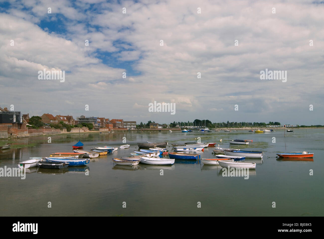 Emsworth Harbour on a beautiful day with the tide in with boats of many ...