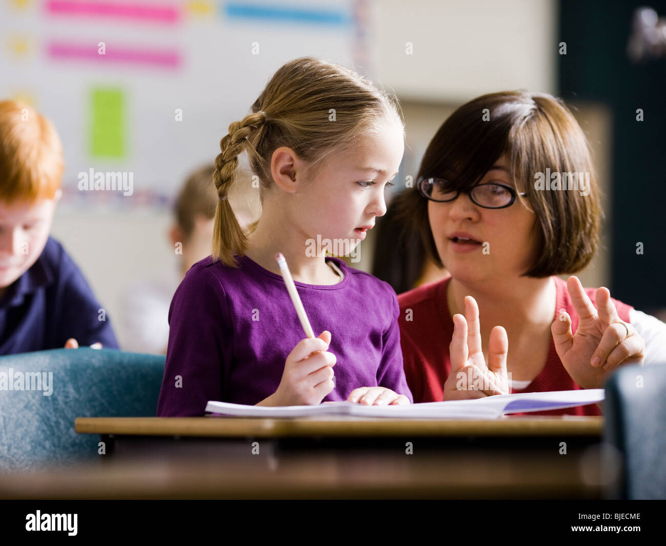 teacher in a classroom Stock Photo - Alamy
