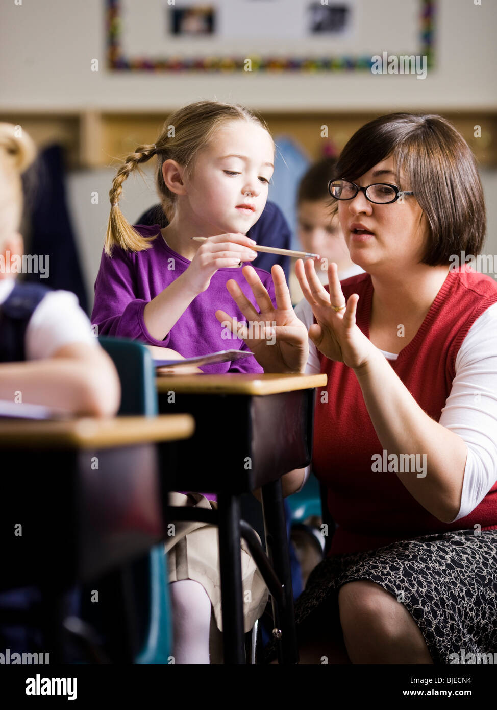 teacher in a classroom Stock Photo - Alamy