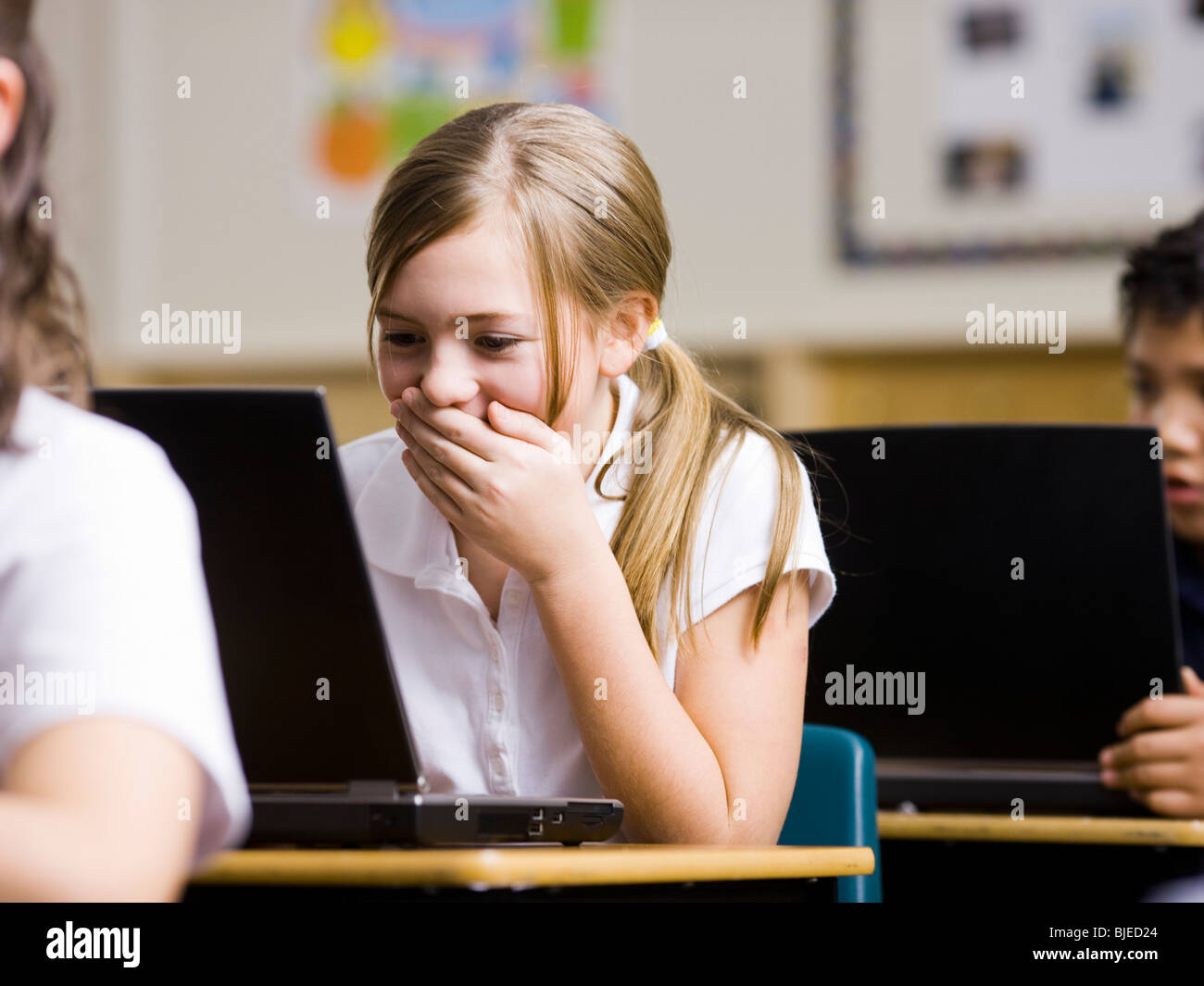girl with laptop in classroom Stock Photo - Alamy