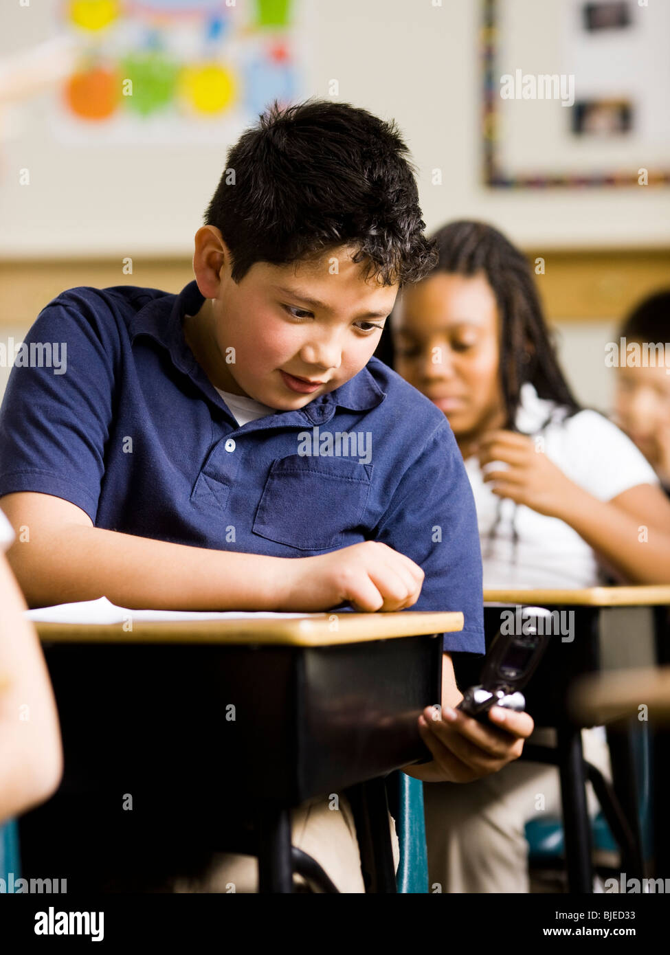 boy texting in school Stock Photo - Alamy