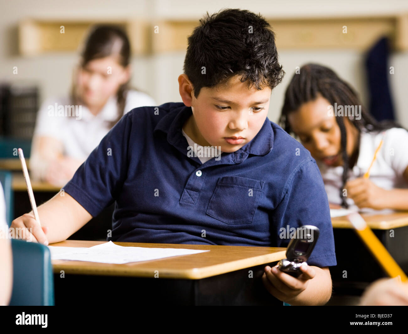 Boy cheating hi-res stock photography and images - Alamy