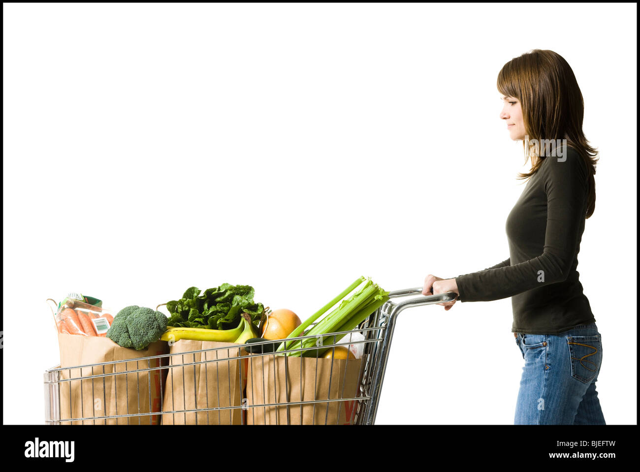 woman pushing a shopping cart Stock Photo - Alamy