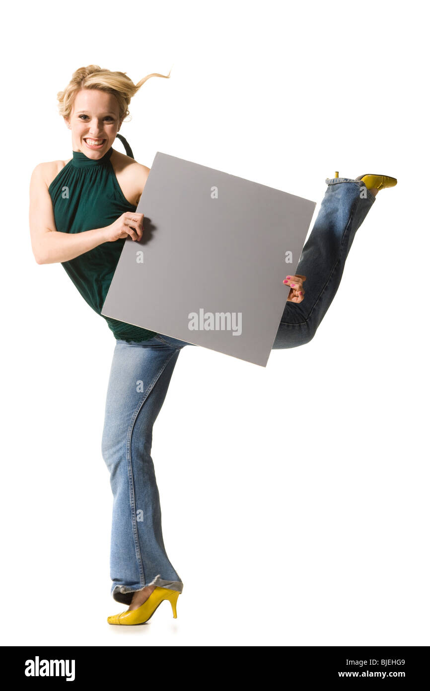 woman jumping with sign Stock Photo - Alamy