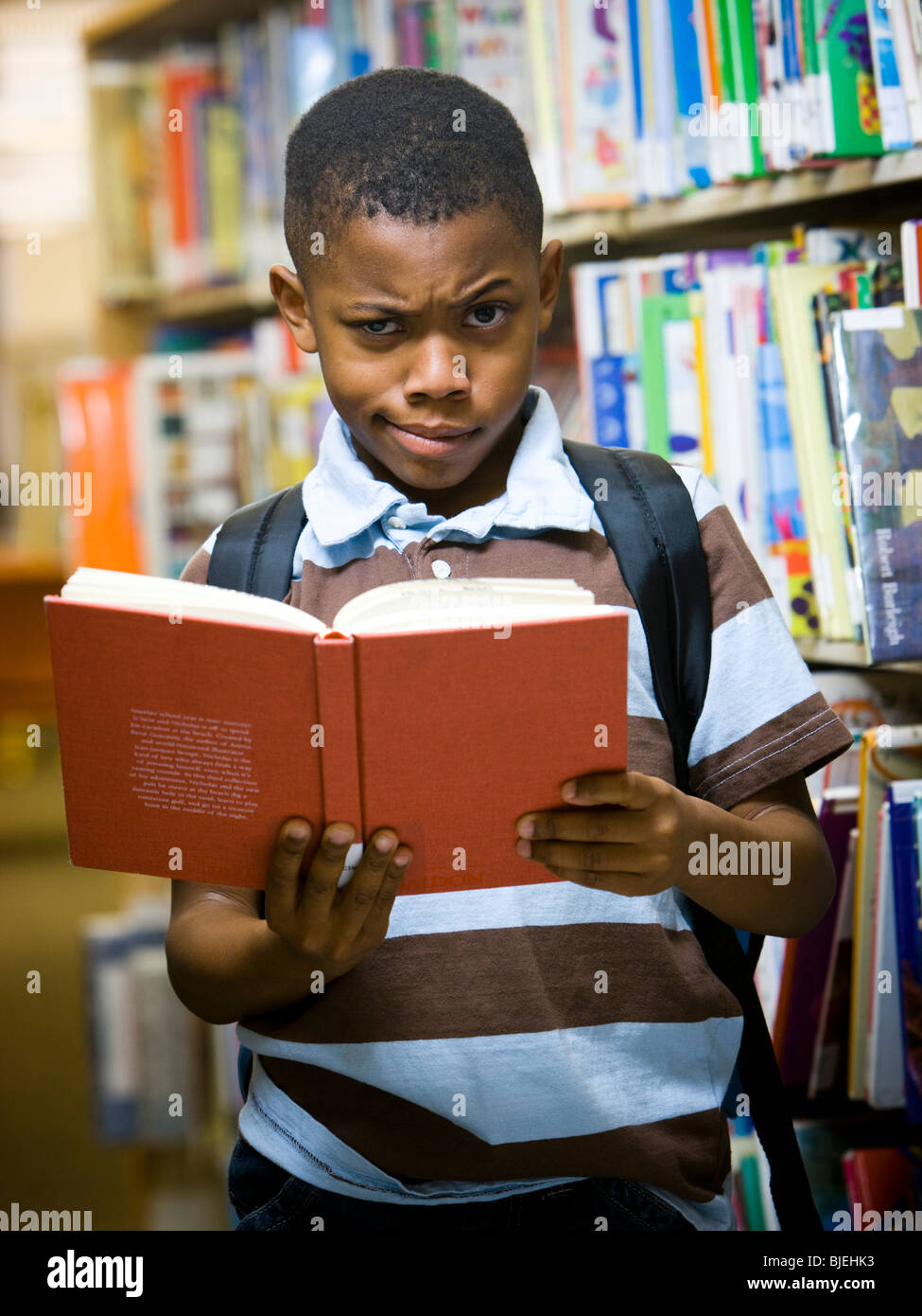 Bookshelves boy library hi-res stock photography and images - Alamy
