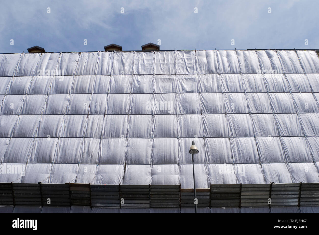 Building covered during renovation Stock Photo - Alamy