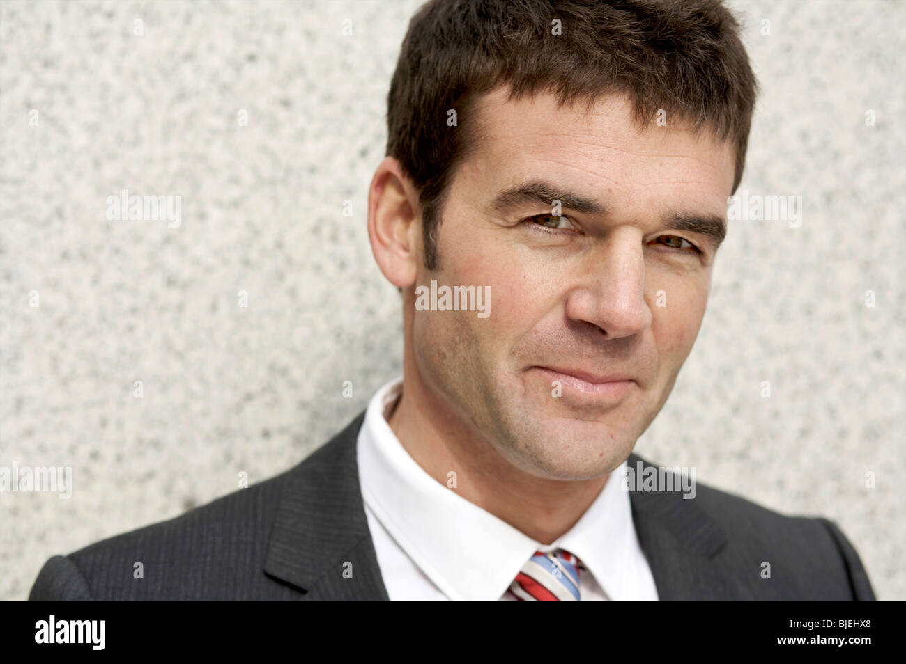 Portrait of an businessman, eye contact Stock Photo - Alamy