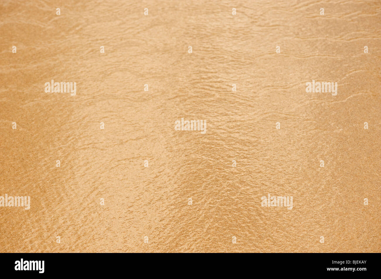 Artistic image of water over sand Stock Photo - Alamy