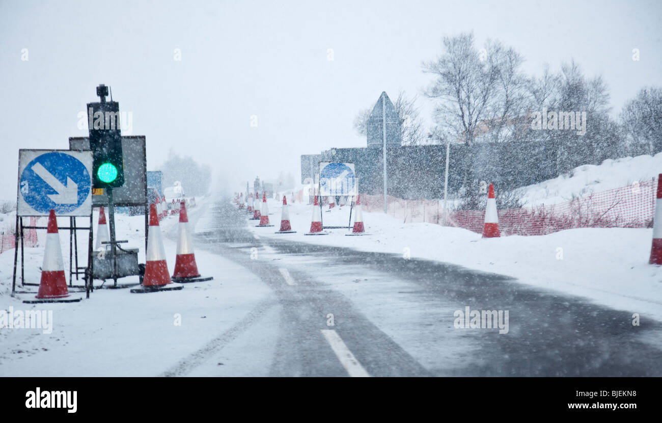 Traffic Lights showing green on roadworks in a blizzard on A82 Scotland ...