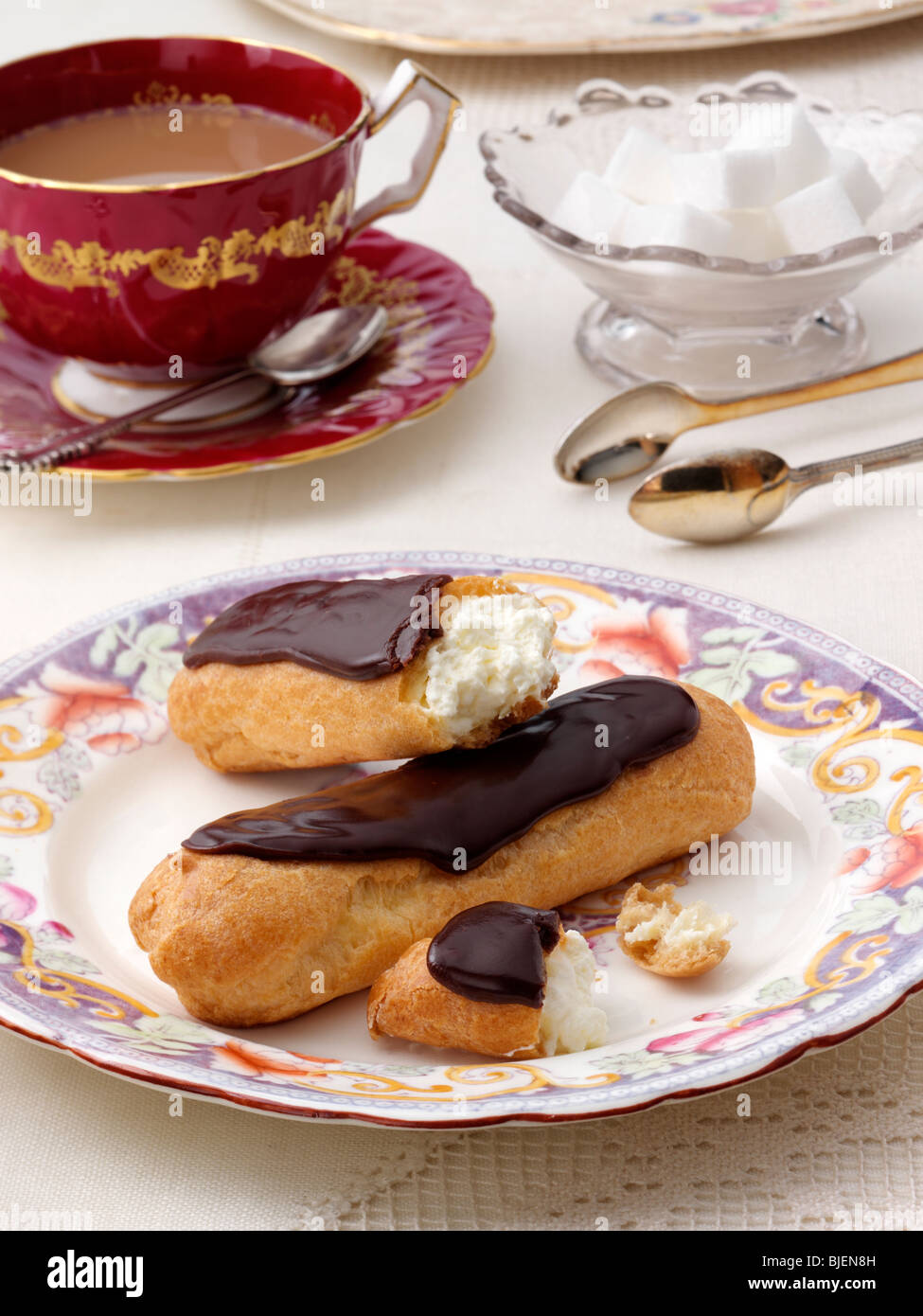 Eclairs in a table setting Stock Photo - Alamy