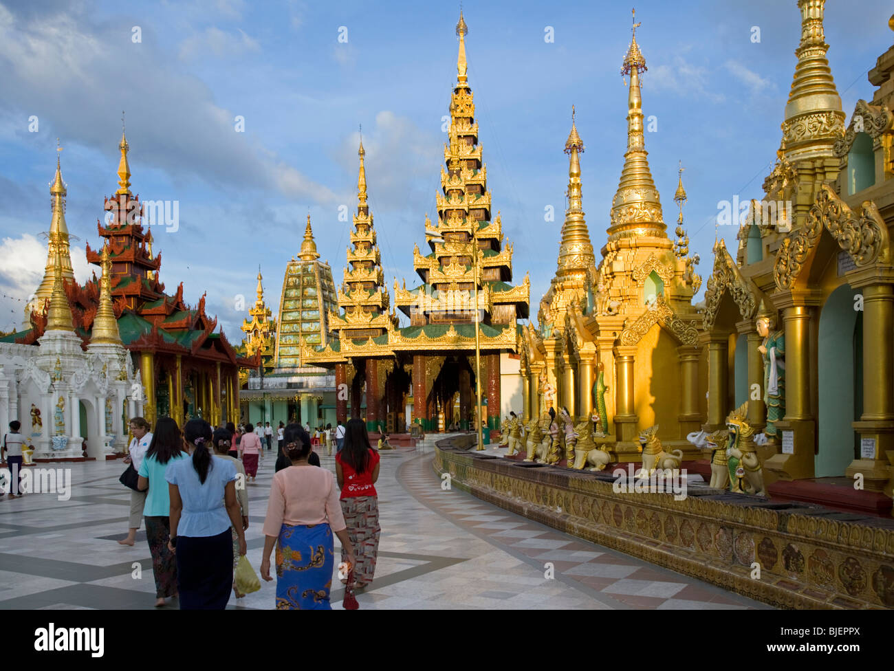 Burmese women circumambulating Shwedagon Paya (buddhist ritual). Yangon ...