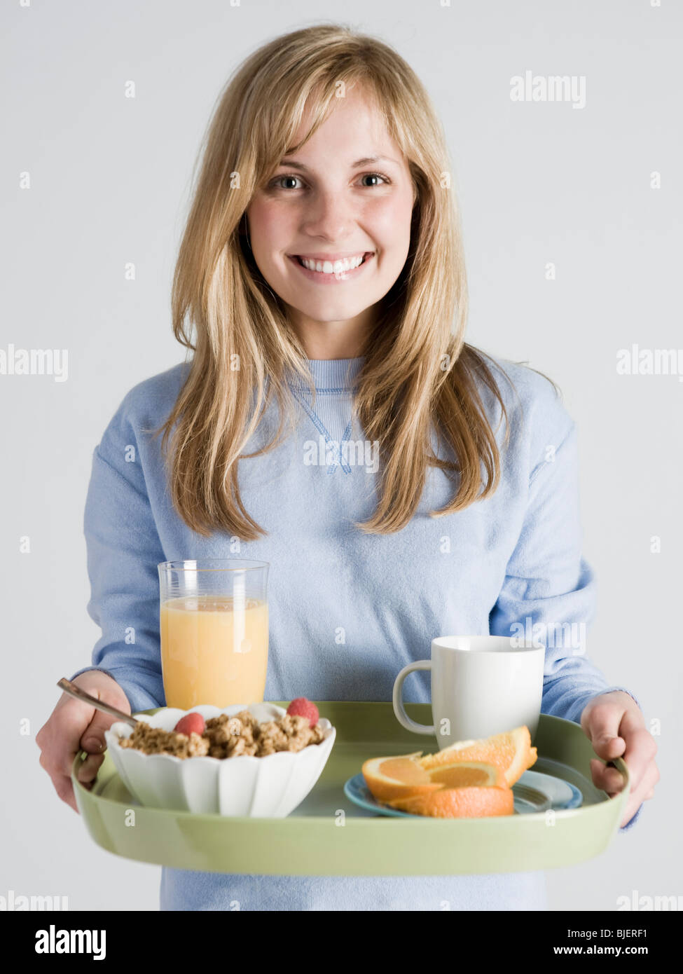 woman carrying breakfast on a tray Stock Photo - Alamy