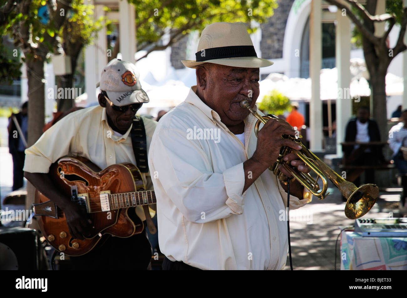Abie Thomas an African busker playing a trumpet on the V&A Waterfront ...