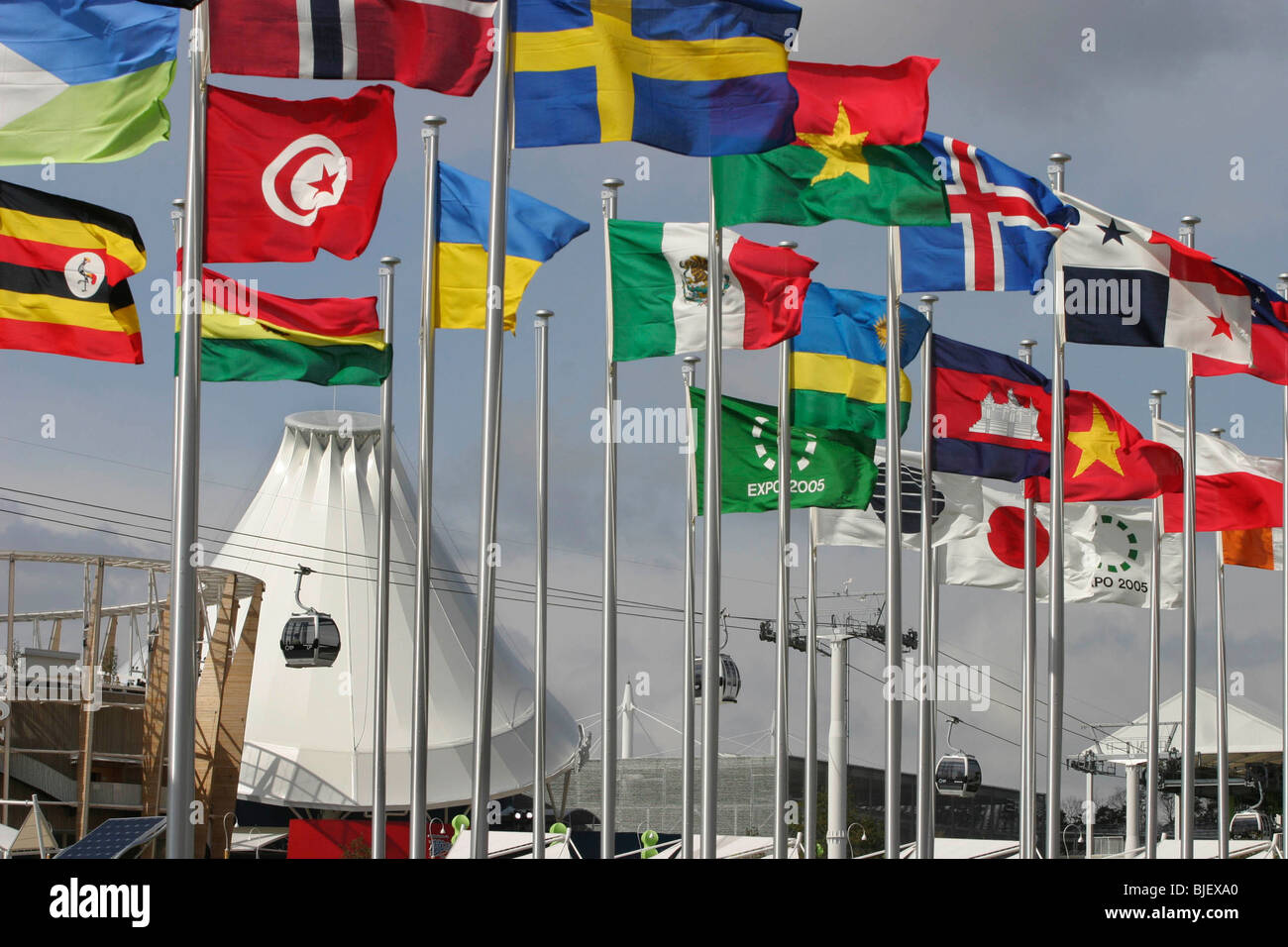 World flags fly in front of the "Mountain Of Dreams" pavilion, shaped ...