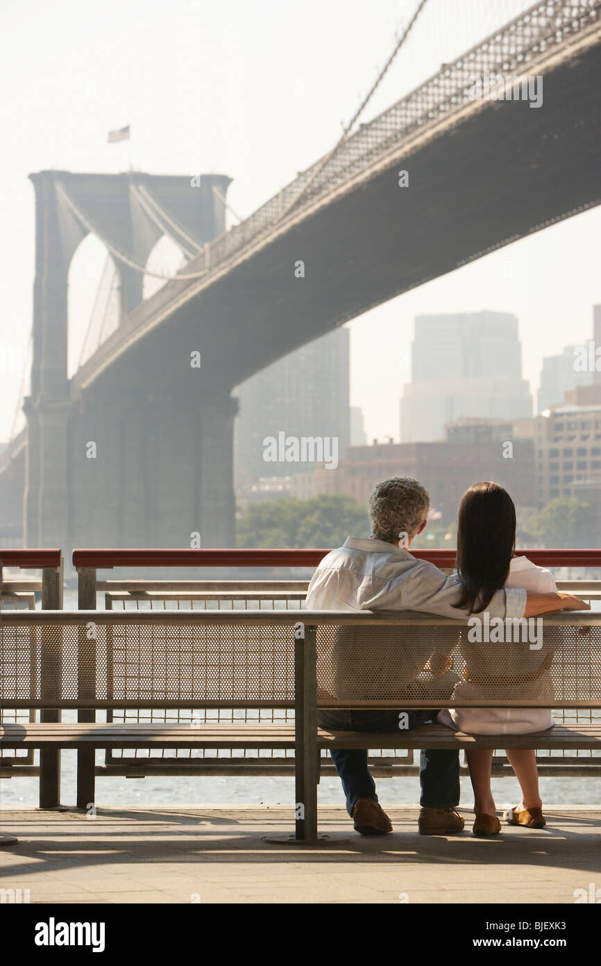 Couple Looking at Bridge Stock Photo - Alamy