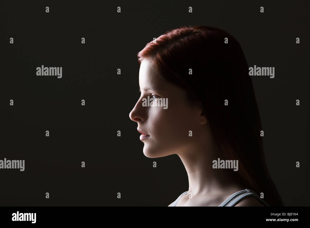 Young woman side view portrait Stock Photo - Alamy
