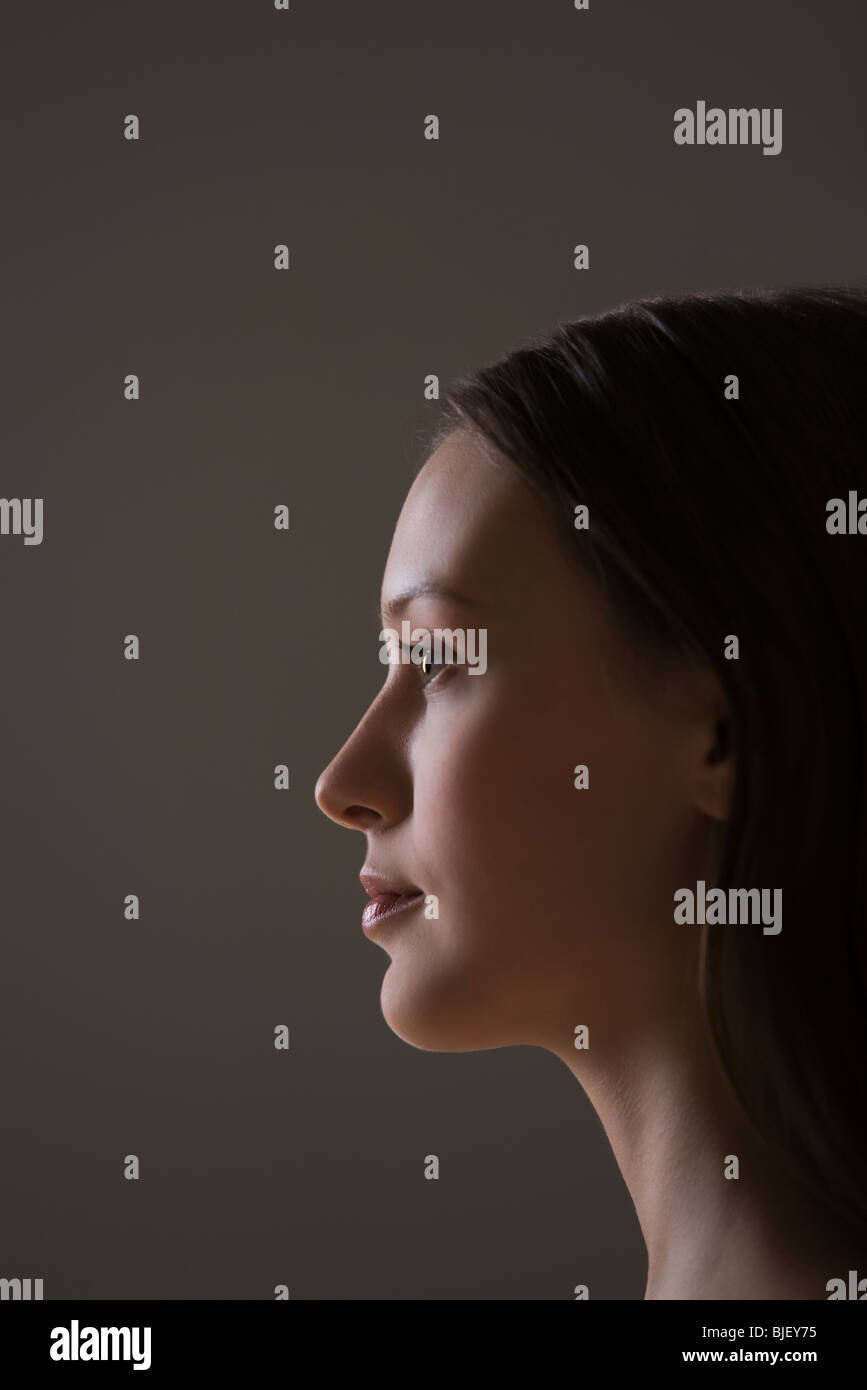 Young woman side view portrait Stock Photo - Alamy