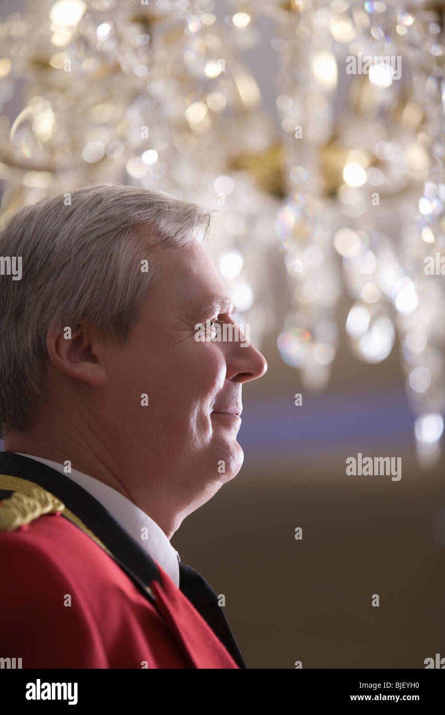 Concierge smiling, side view portrait Stock Photo - Alamy