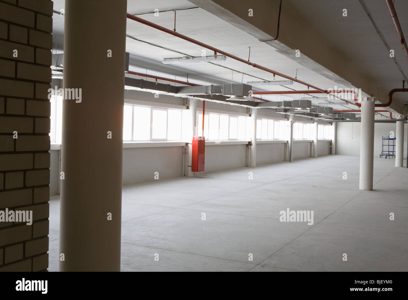 Empty warehouse, room with windows Stock Photo - Alamy