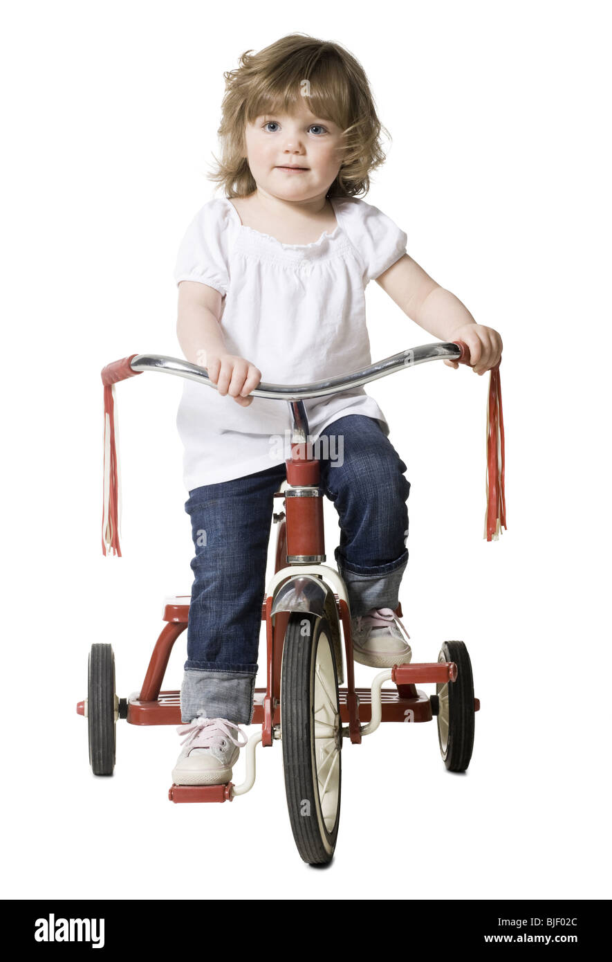 little girl on a tricycle Stock Photo - Alamy