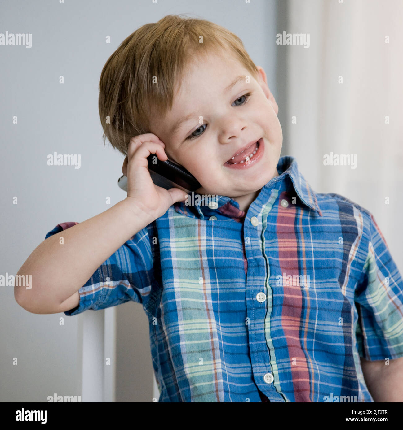 little boy on a cell phone Stock Photo - Alamy