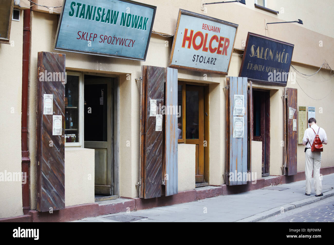 Man outside restored traditional Jewish shops in Kazimierz district ...